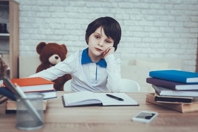 Boy. Sit at Homework. Pensive Look. Sit at Table. Stock Image - Image ...