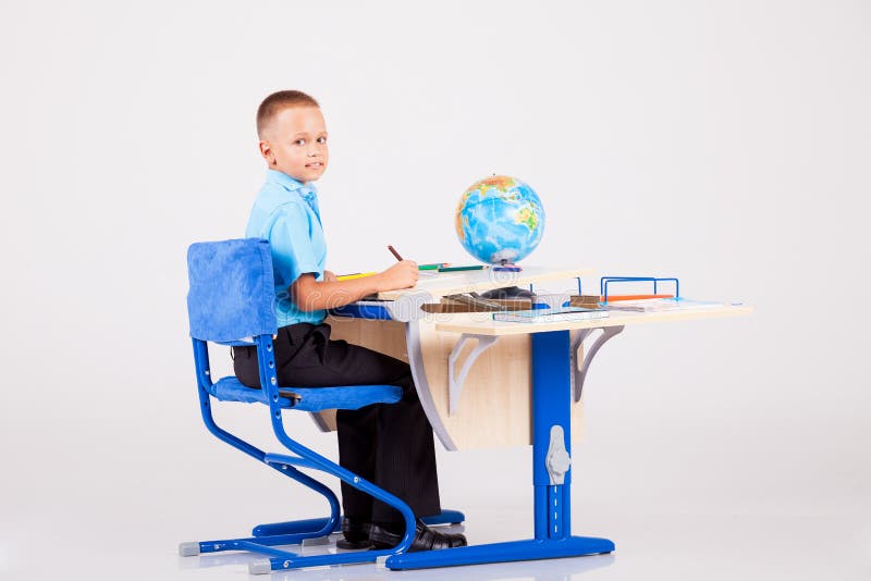 Boy Sits at His Desk and Doing Homework Stock Image - Image of children ...