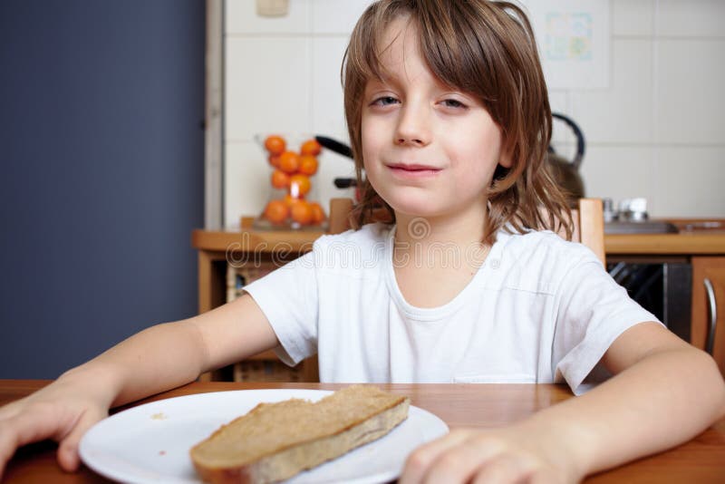 Boy Sits at Kitchen Table and Doesn T Want To Eat Stock Photo - Image ...