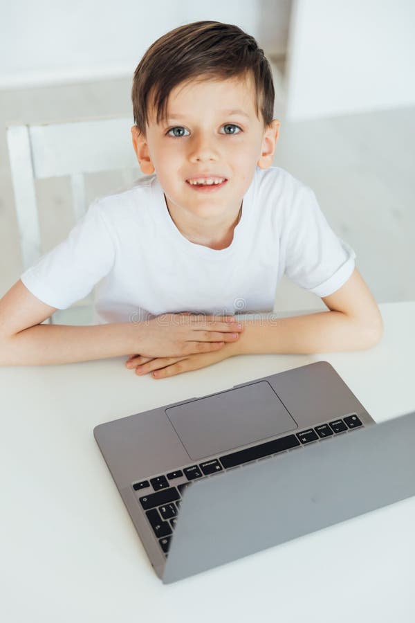 A Boy Sits in a Lesson at a Computer a Student School Learning Online ...
