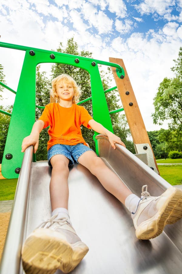 Happy Kids on Playground Chute in the Park Stock Image - Image of ...