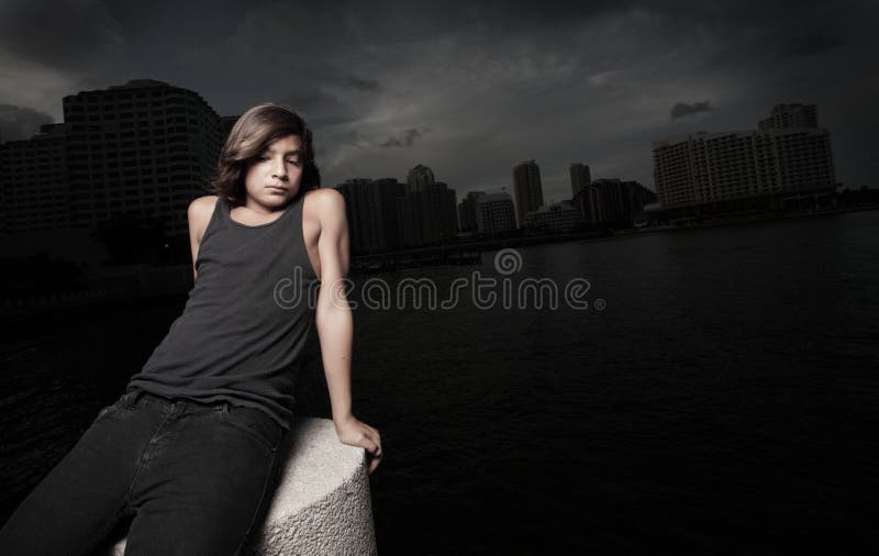 Boy sitting alone at night stock image. Image of lonely - 11045129