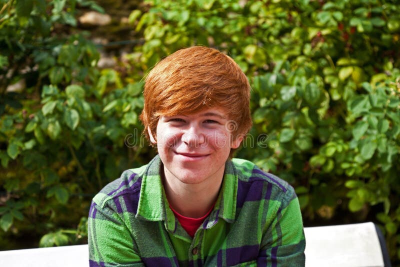 Boy sitting on a bench stock photo. Image of garden, adolescent - 16302488