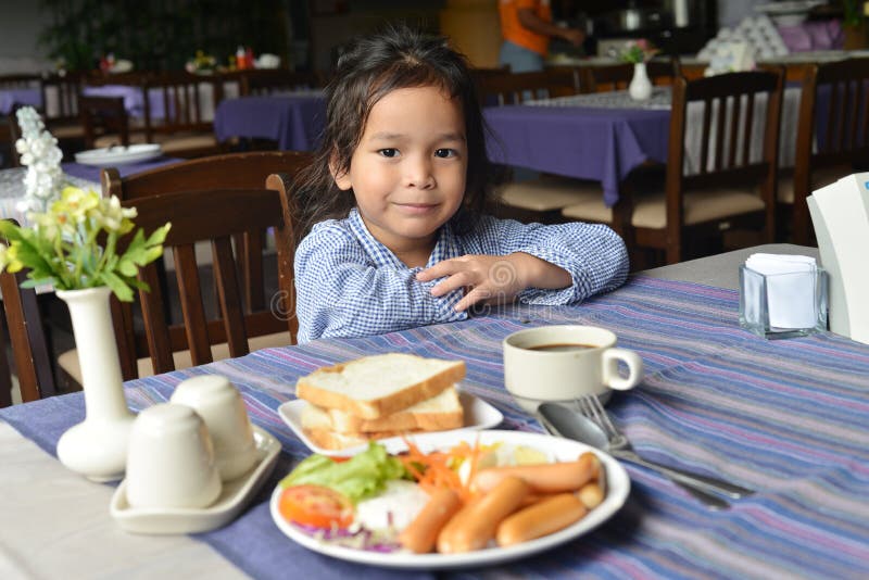 Boy Sitting at Breakfast Table Stock Photo - Image of cafeteria ...
