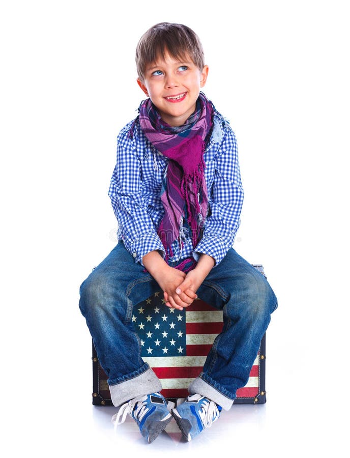Boy sitting on a case stock photo. Image of luggage, cute - 53992636