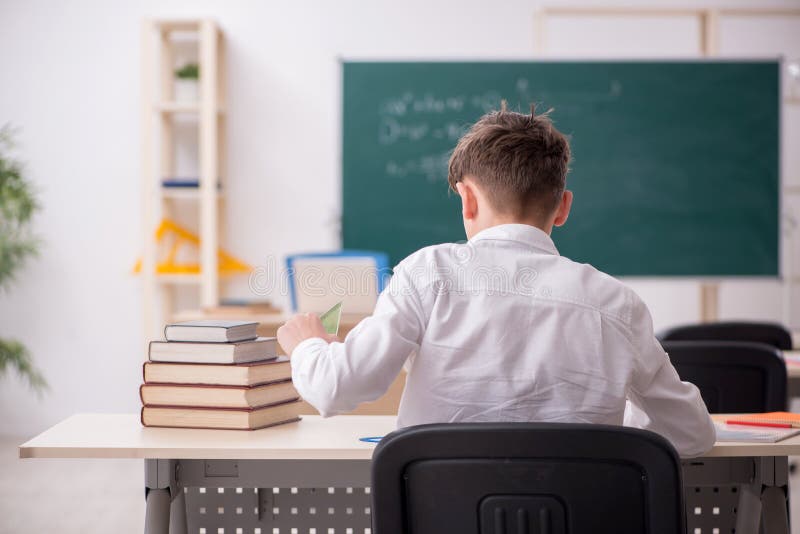 Boy Sitting in the Classrom Stock Image - Image of schoolboy, study ...