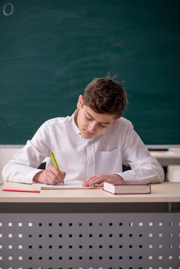 Boy Sitting in the Classrom Stock Photo - Image of preparing, schoolboy ...