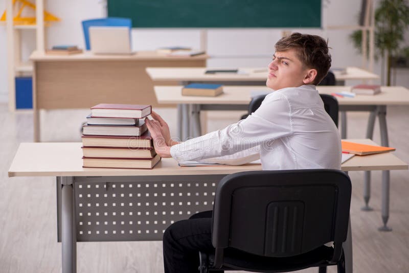 Boy Sitting in the Classrom Stock Image - Image of study, back: 234225227