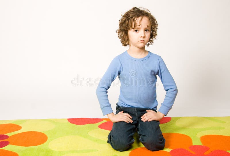 Boy Sitting on Colorful Carpet Stock Image - Image of happy, childhood ...