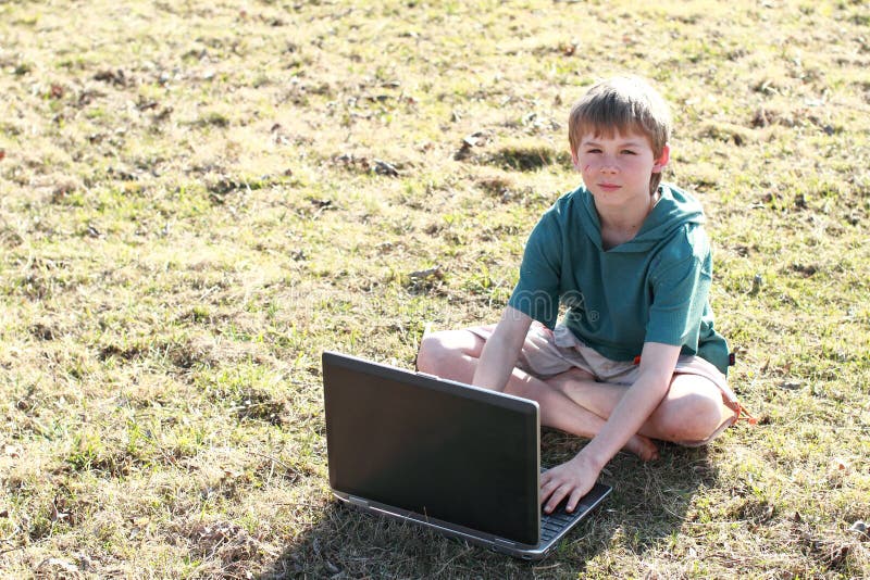 Boy Sitting with a Computer Stock Photo - Image of computer, barefooted ...