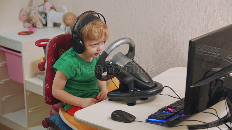Boy Sitting at the Computer Stock Video - Video of white, candid: 239494429