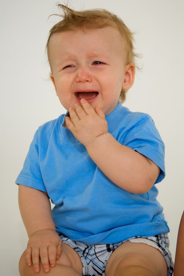 Boy Sitting and Crying stock image. Image of white, vertical - 10634445