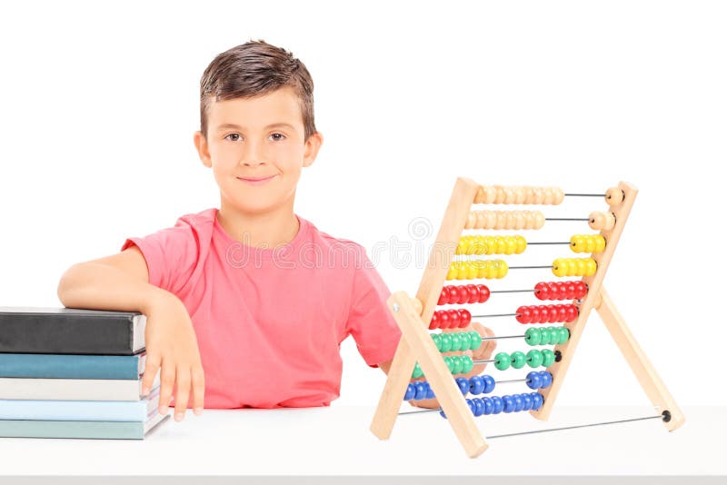 Boy Sitting at a Desk with an Abacus and Books on it Stock Image ...
