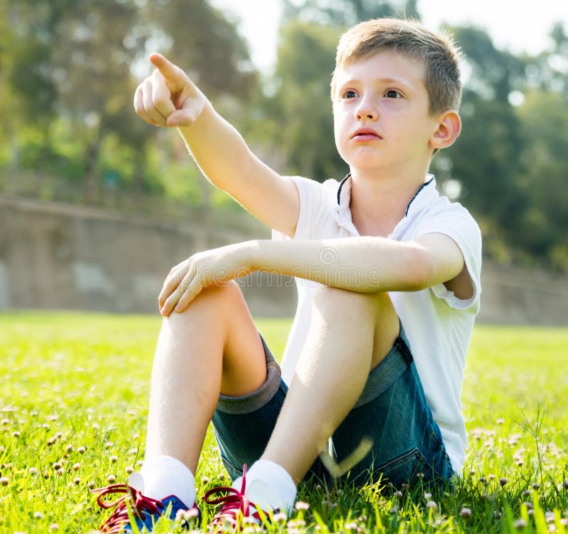 Boy sitting grass stock photo. Image of offspring, australian - 86138198