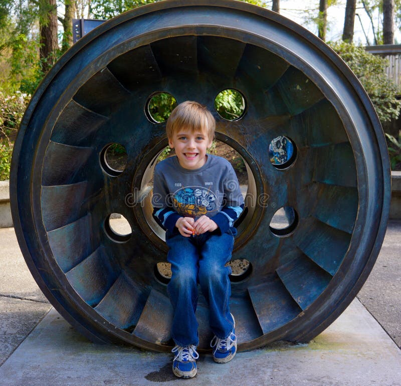 Boy Sitting Inside Circle Hydro Wheel Stock Image - Image of hydropower ...