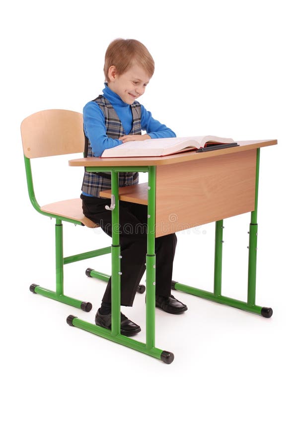 Boy Sitting at a School Desk Stock Photo - Image of education, smiling ...