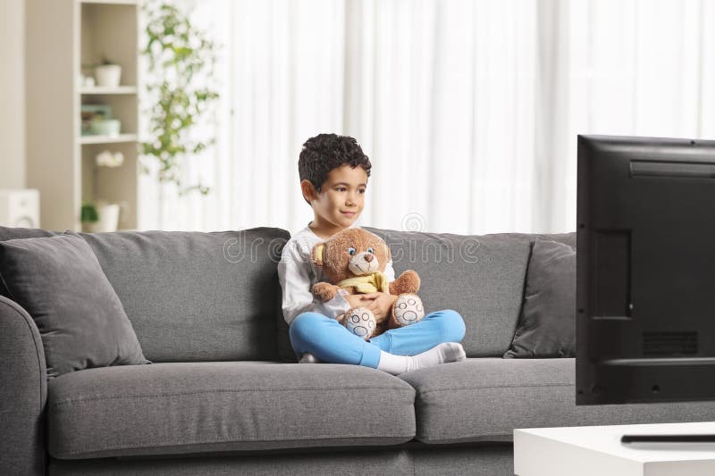 Boy Sitting on a Sofa with a Teddy Bear Stock Image - Image of pillow, comfortable: 375280973