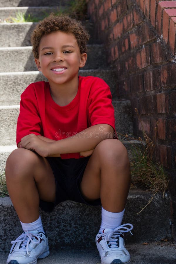 Boy Sitting on Staircase in the Boot Camp on a Sunny Day Stock Photo ...