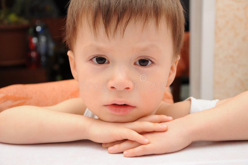 Boy sitting at the table stock image. Image of sitting - 38186793
