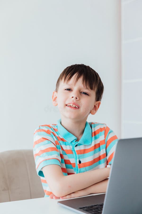 Boy Sitting at Table with Laptop Learning Games Online Stock Image ...