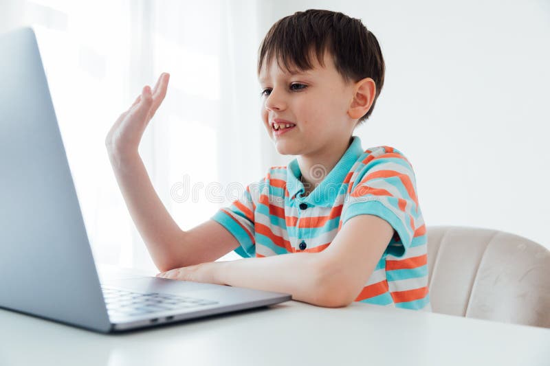 Boy Sitting at Table with Laptop Learning Games Online Stock Image ...