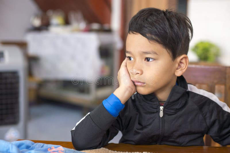Boy Sitting on the Table, Thinking about Something. Stock Photo - Image ...