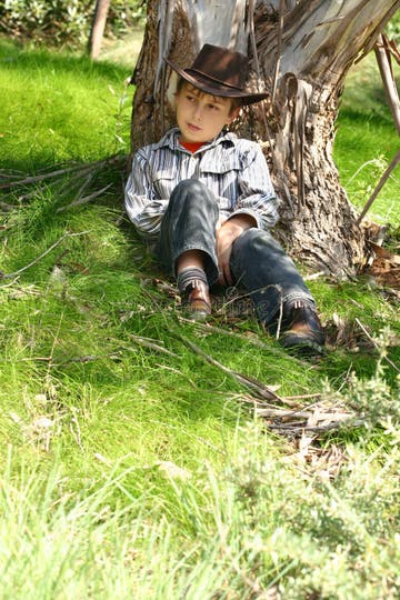 2,041 Boy Sitting Under Tree Stock Photos - Free & Royalty-Free Stock ...