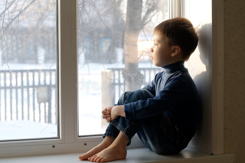 Boy Sitting on the Window Looking Out Stock Image - Image of frost ...