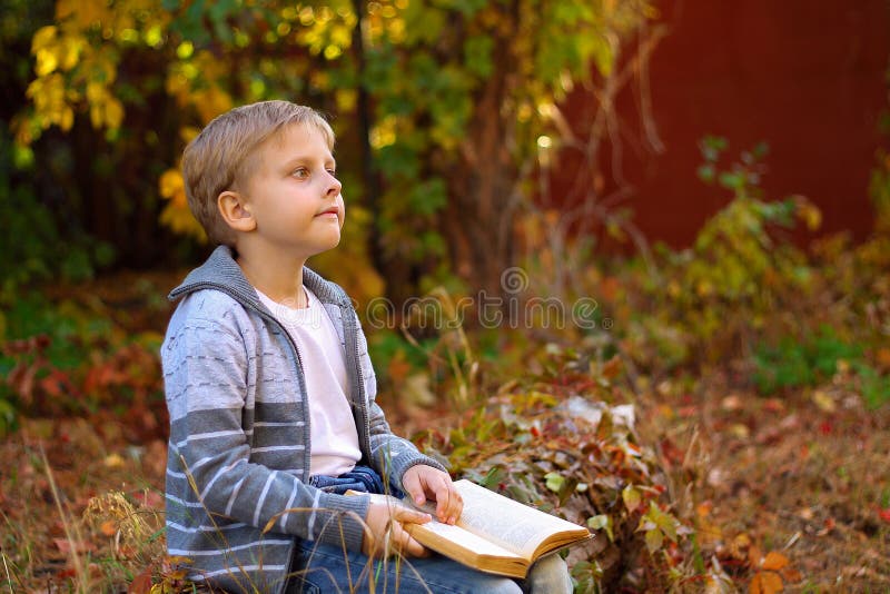 Boy Sitting in the Woods on a Log Stock Image - Image of pensive, walk ...