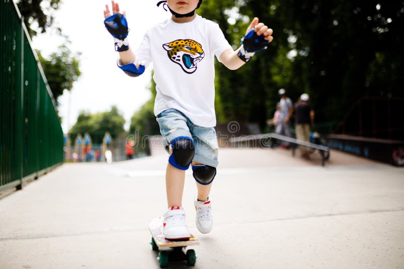 Boy with a Skate in a Skate Park. the Boy Learns To Skate, in Full ...