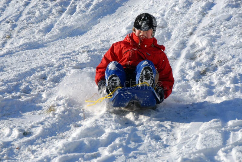 Boy on sled stock photo. Image of mountain, nature, outdoors - 7629186