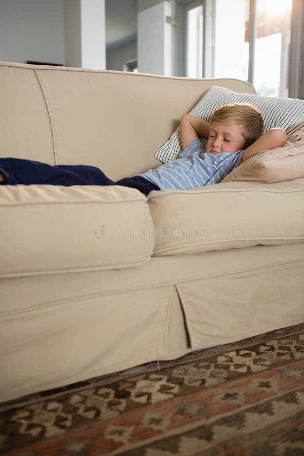 Boy Sleeping on Sofa in the Living Room Stock Photo - Image of ...