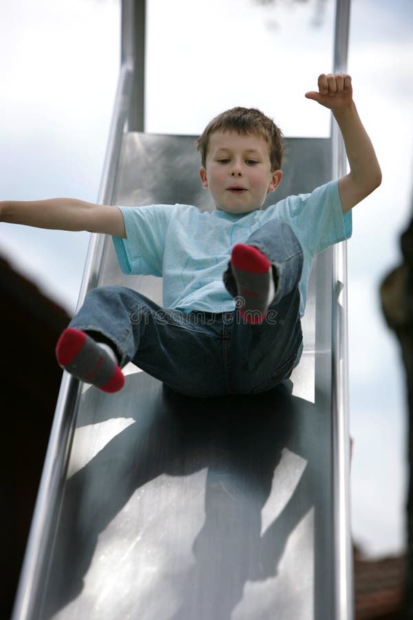 Boy on slide stock image. Image of playful, childhood - 15478457