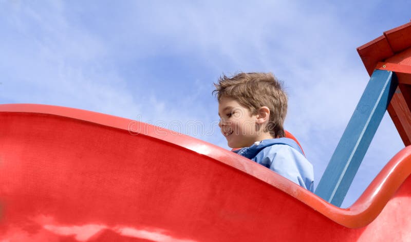 Boy on the slide stock image. Image of childhood, sunny - 2413499