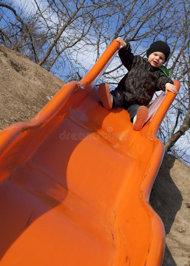Boy on a slide stock image. Image of beautiful, outside - 24581421