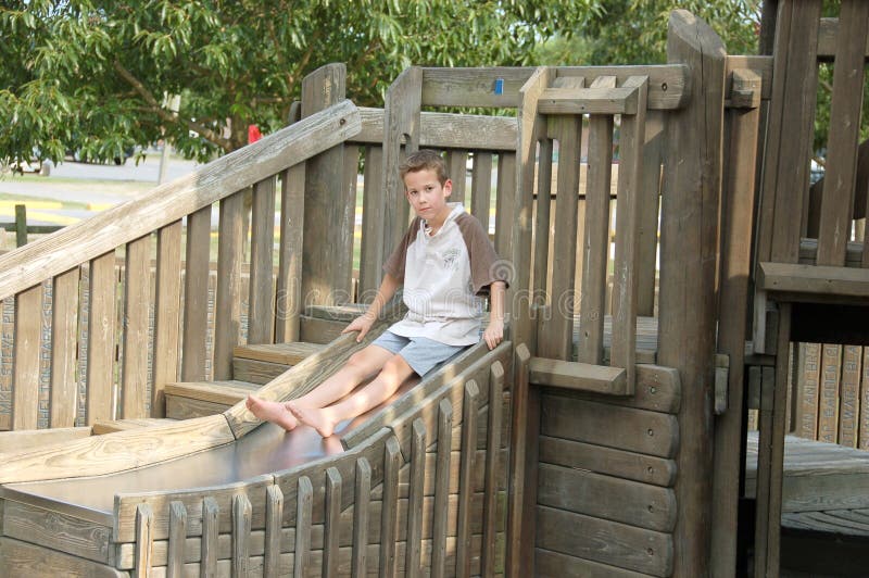 Boy on slide stock image. Image of male, play, outside - 6089449