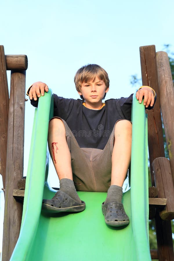 Boy on slide stock photo. Image of smiling, childhood - 41365800
