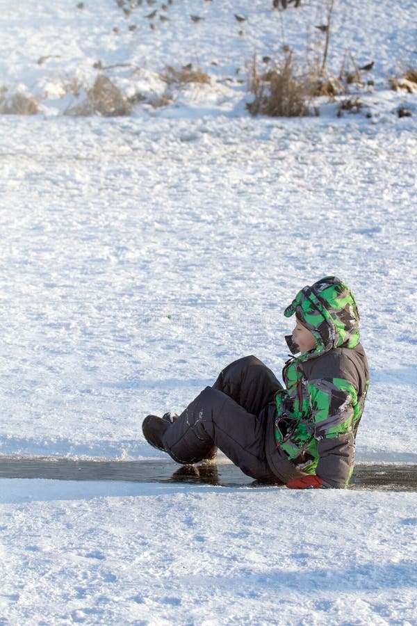 Boy Sliding on Ice Rink stock photo. Image of children - 167456394