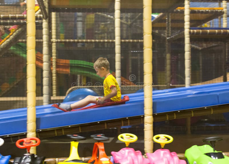 Boy sliding on playground stock photo. Image of sliding - 106419042