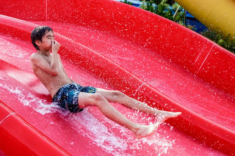 Boy Sliding on a Water Slide Stock Image - Image of park, female: 98910657