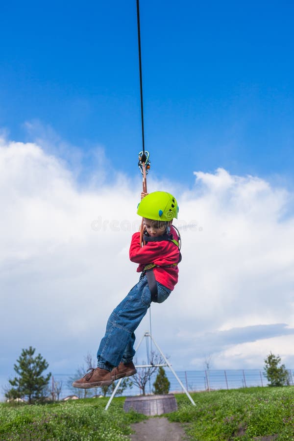 Boy sliding on zip line stock image. Image of cable, climber - 44372629