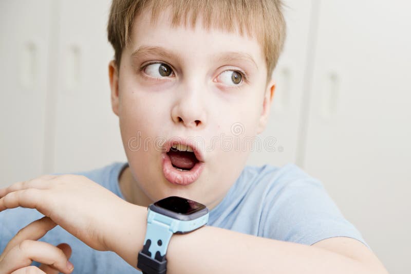 A boy with a smart watch stock image. Image of cute - 188426763