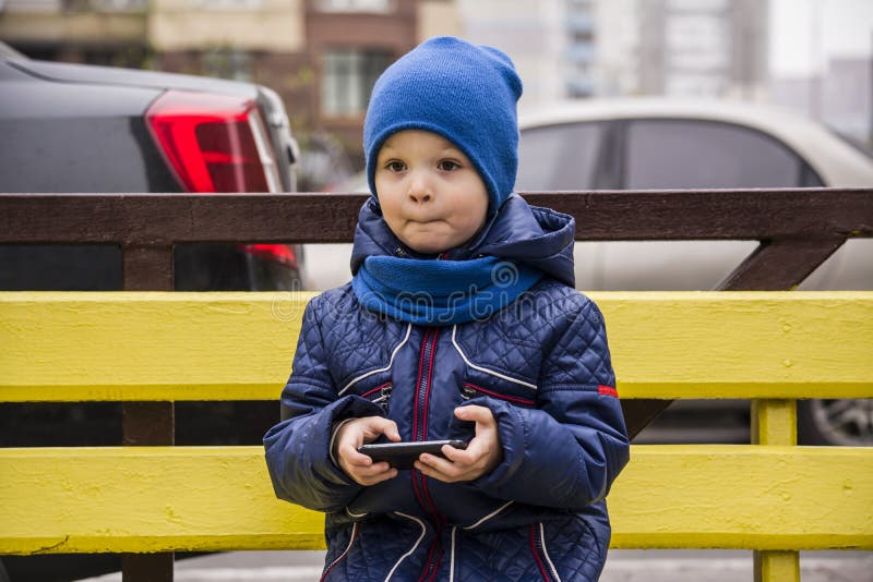 A boy and a smartphone stock image. Image of playing - 62252781