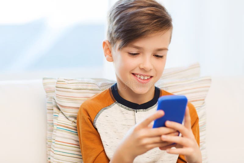 Boy with Smartphone Texting or Playing at Home Stock Photo - Image of ...