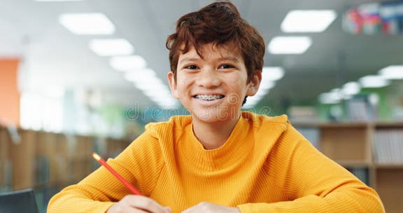 Boy, Smile and Child with Learning at Library with Math, Study or ...