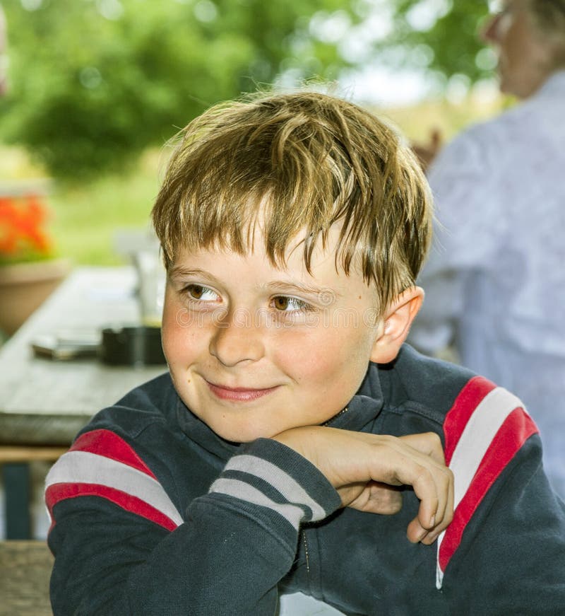 Boy Smiles and Has Fun Sitting at the Table Stock Image - Image of cute ...