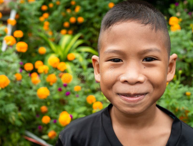Boy Smiling Face Portrait on a Garden Background Stock Image - Image of ...