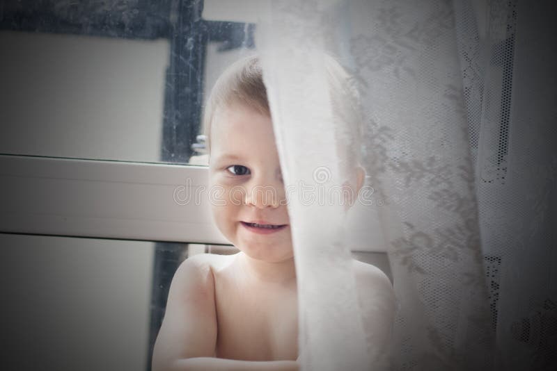 Boy Smiling Hiding Behind Curtains Stock Photo - Image of adorable ...