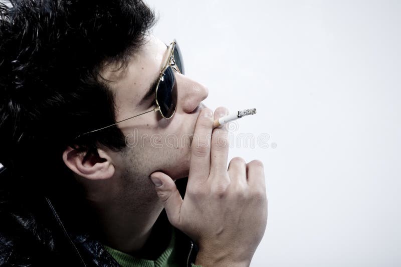 Boy smoking a cigarette stock image. Image of fire, rebellious - 5696237