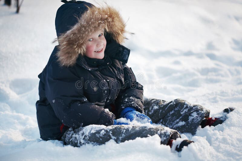 Boy in the snow stock photo. Image of jacket, snow, child - 18340706